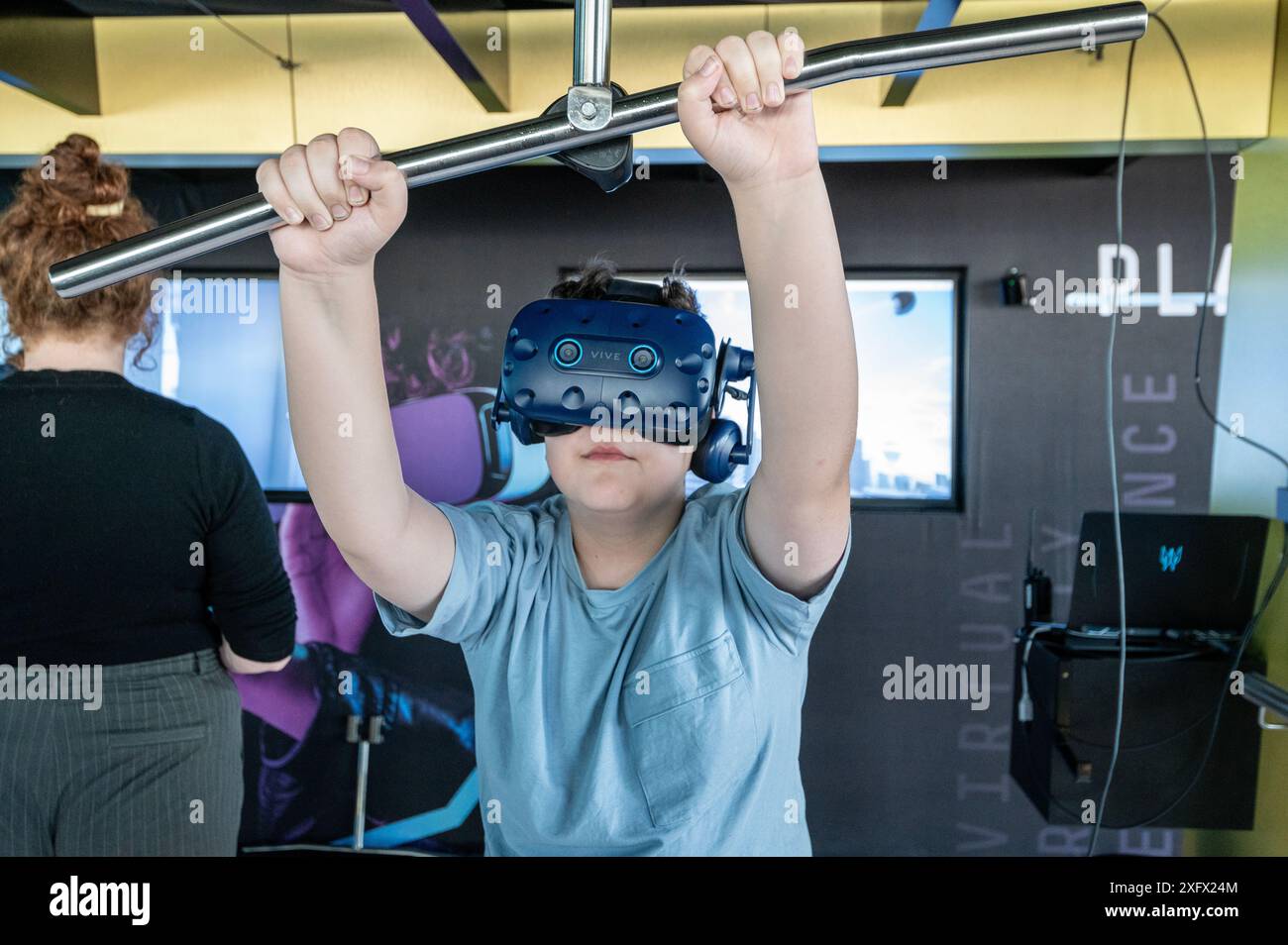 Youngsters bravely treading the VR Plank wearing virtual reality (VR ...