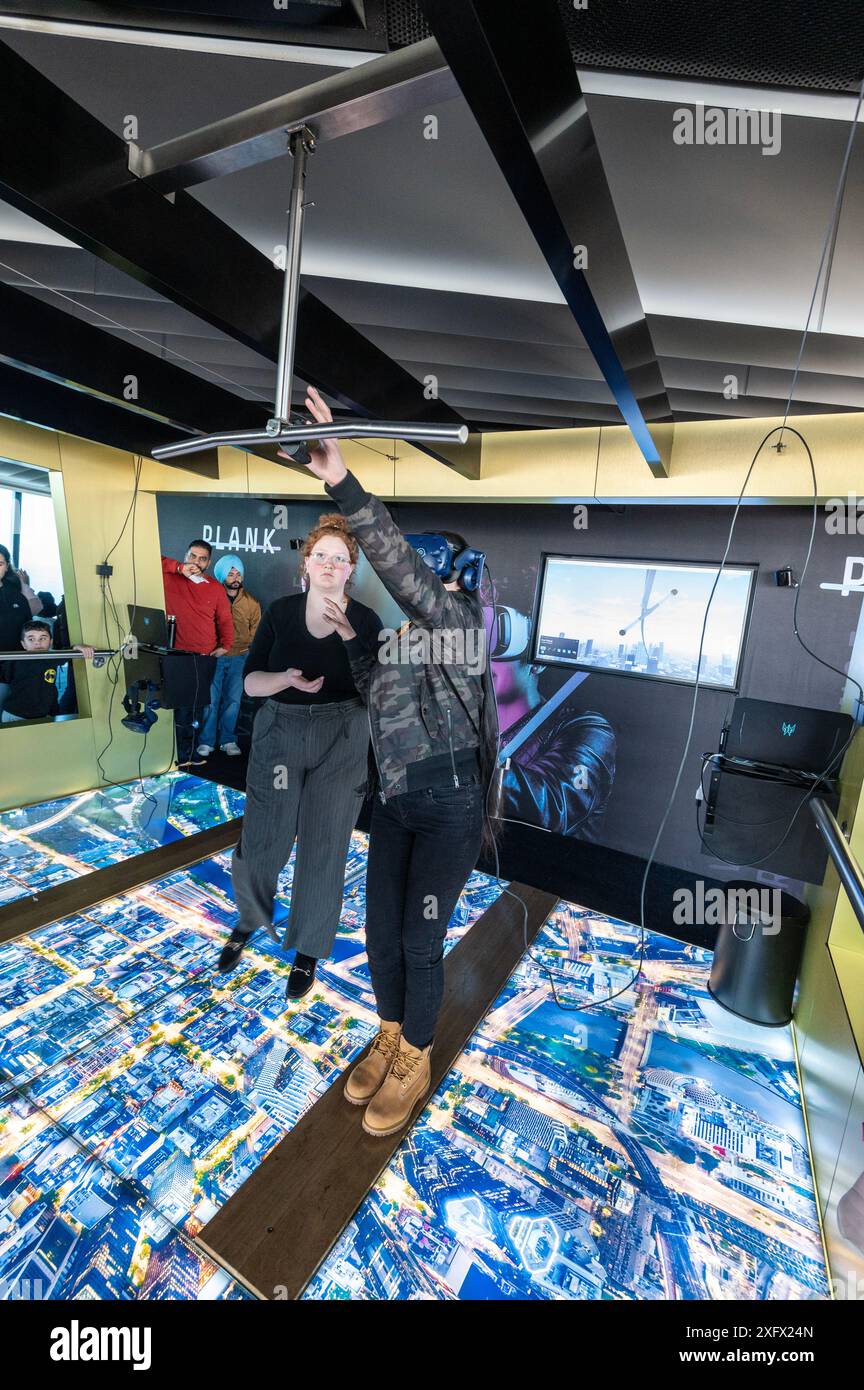 Youngsters bravely treading the VR Plank wearing virtual reality (VR ...