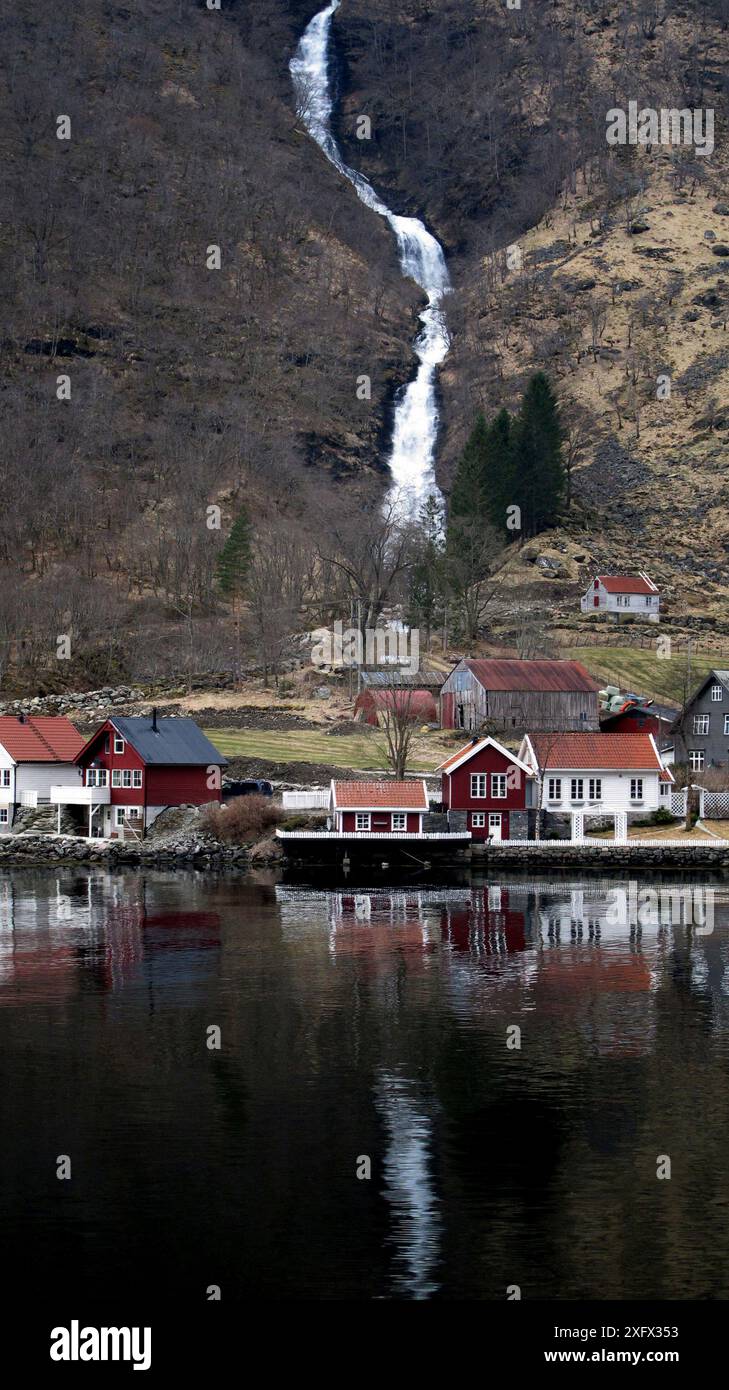 A small vilage and waterfall in Birch woodland on the slopes of ...