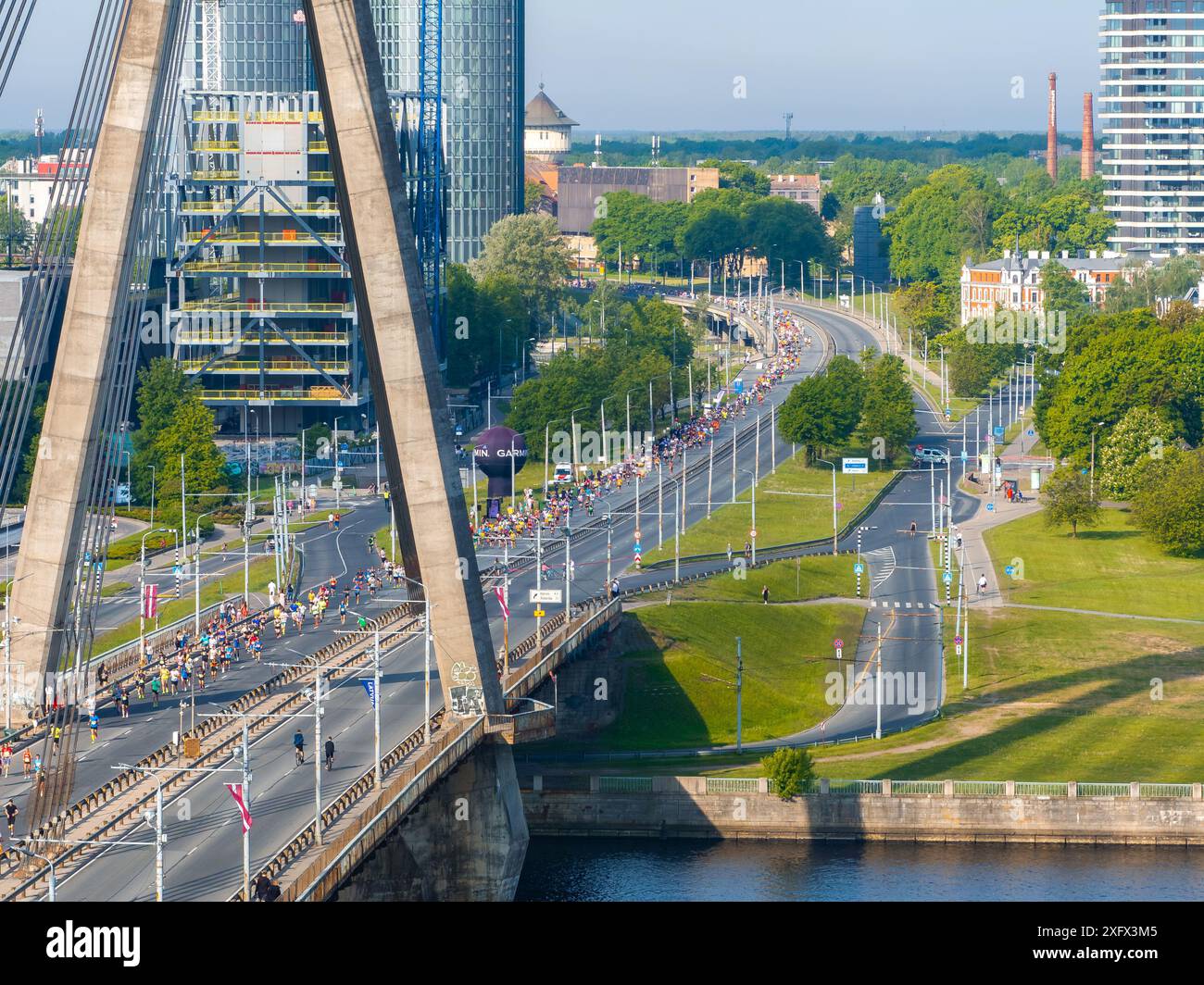Aerial View of Marathon Runners Crossing Iconic Bridge in Riga, Latvia ...