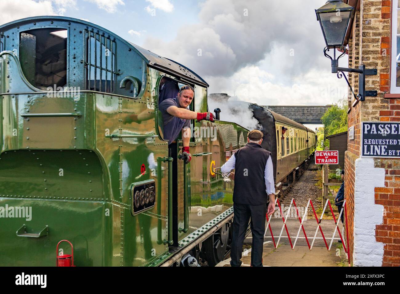 Preserved ex-GWR steam loco 6695 arriving at Williton station and ...