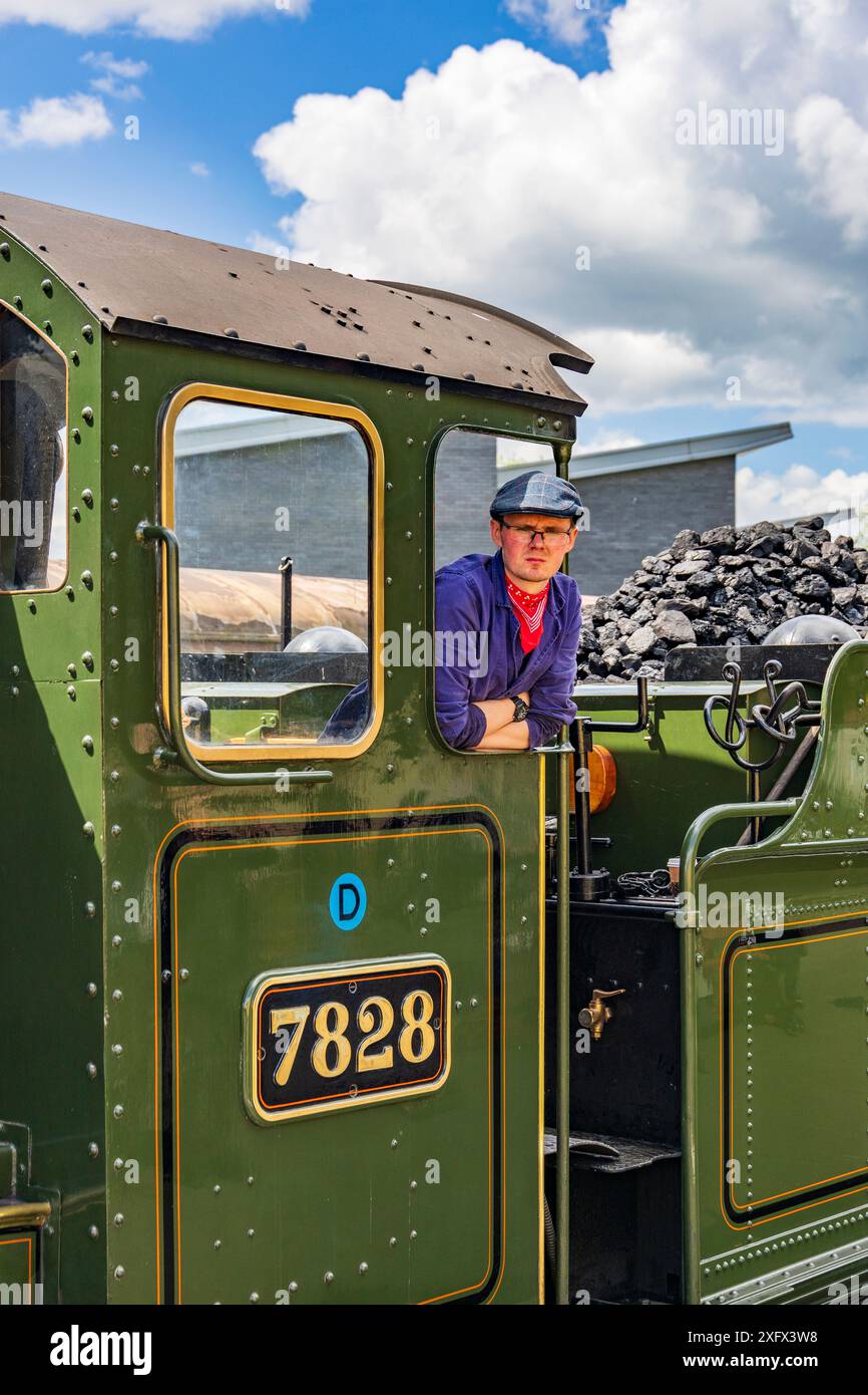 The fireman of preserved ex-GWR steam loco 7828 'Odney Manor' at Minehead station at the West ...