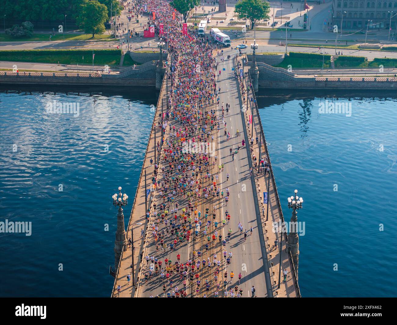 Aerial View of Marathon Runners Crossing a Bridge in Riga, Latvia Stock ...