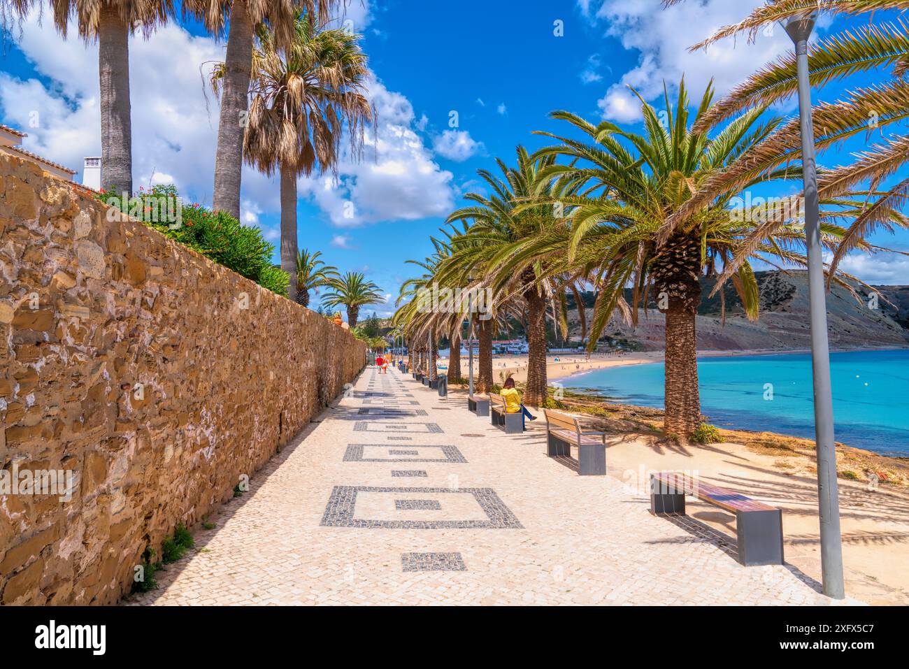 Praia da Luz promenade Portugal with palm trees by beach the Algarve ...