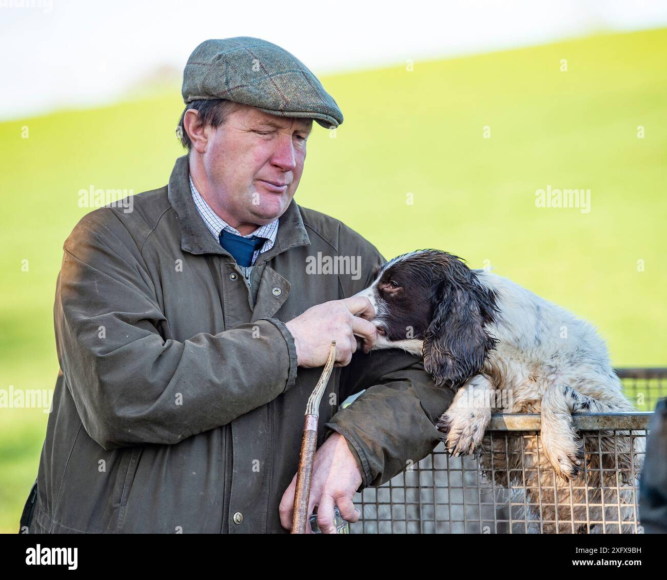game keeper and his spaniel dog Stock Photo - Alamy