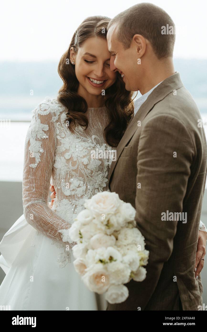 bride and groom first meeting on the roof of a glass skyscraper Stock ...