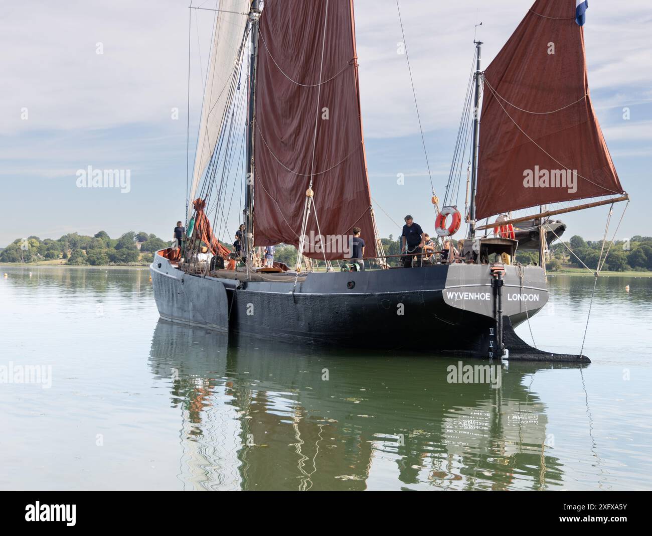 Thames sailing barge Wyvenhoe on a still calm River Orwell Suffolk ...