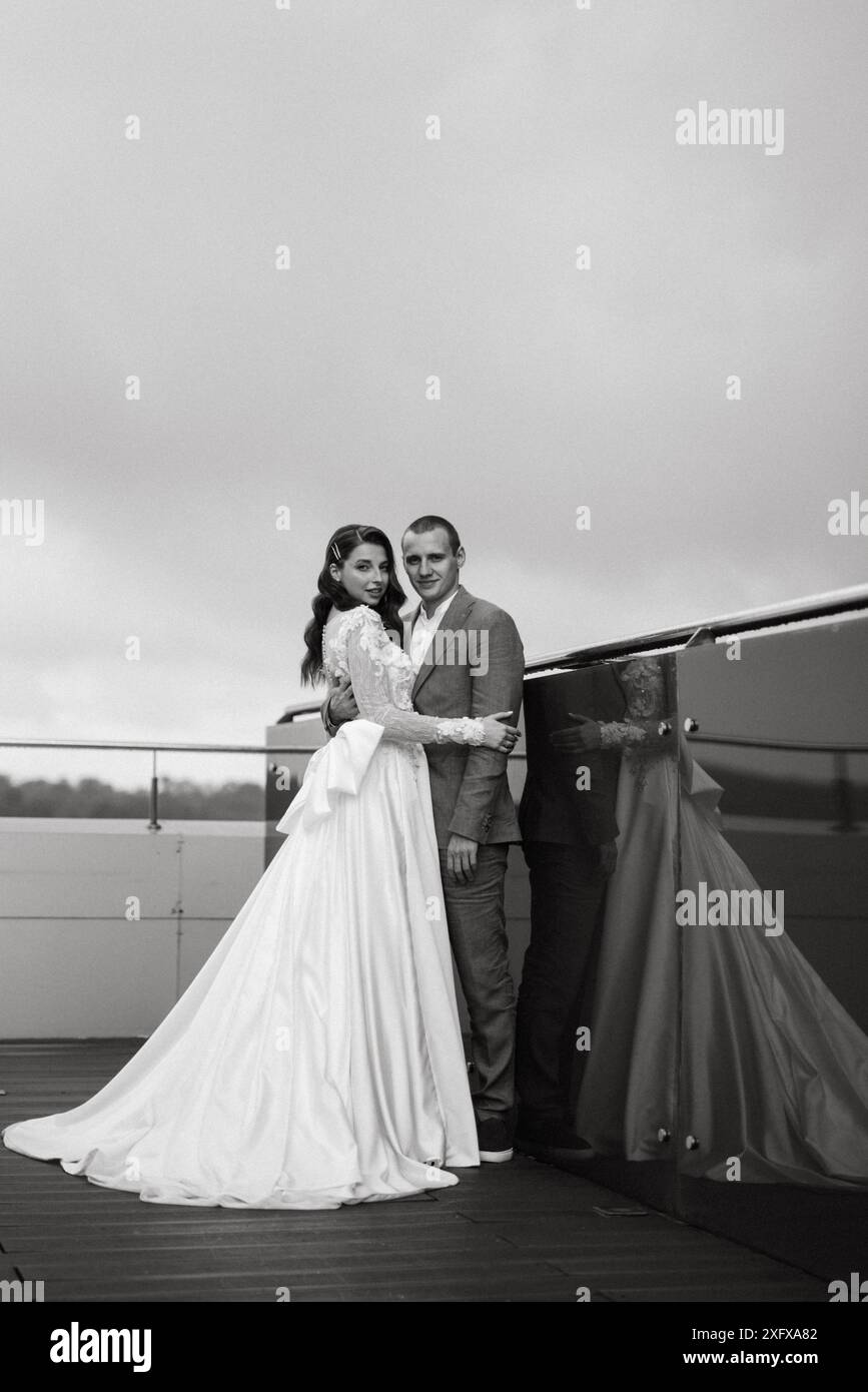 bride and groom first meeting on the roof of a glass skyscraper Stock ...