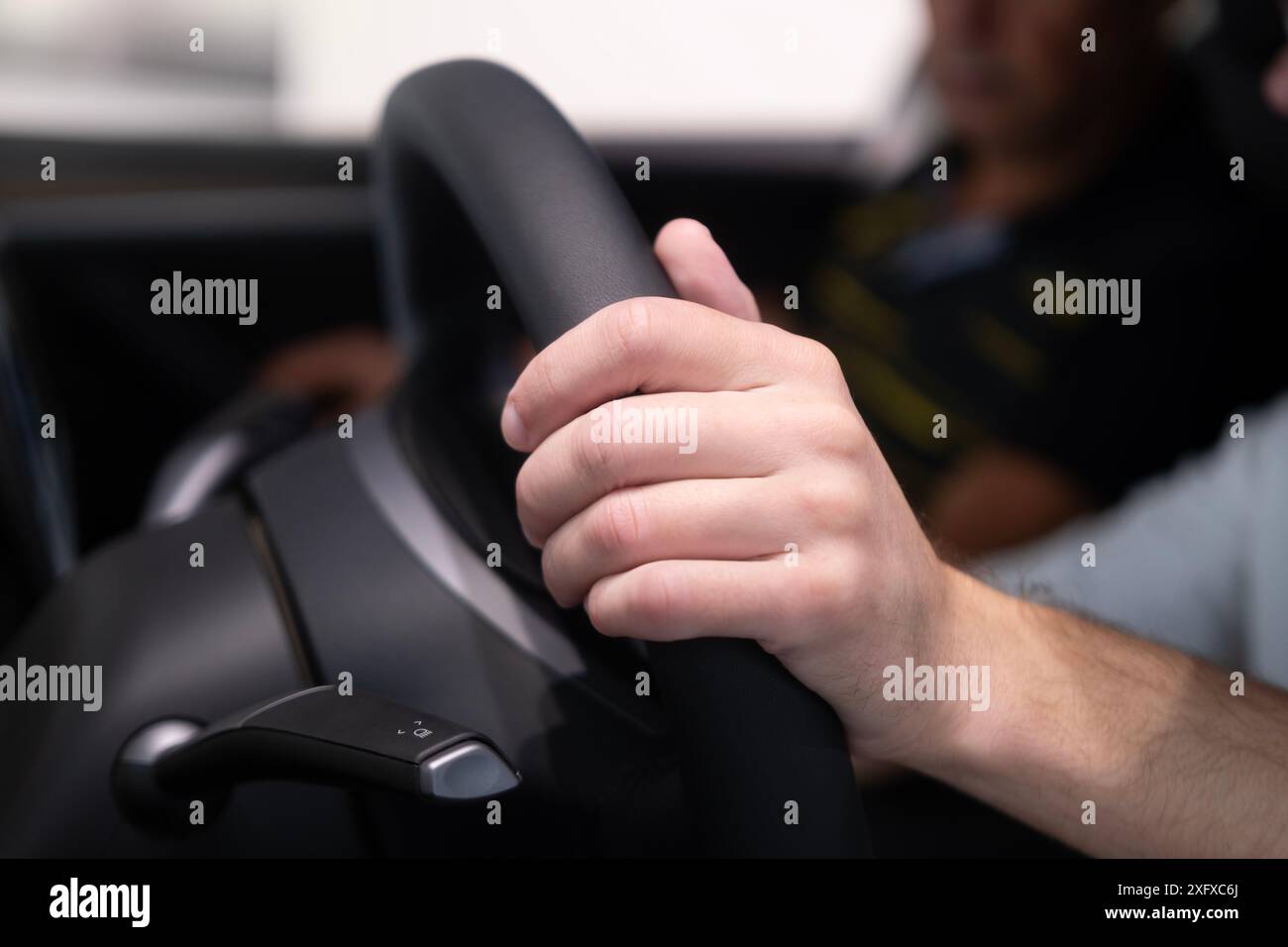 cockpit, male hand on Driver's column, Behind steering wheel electric ...