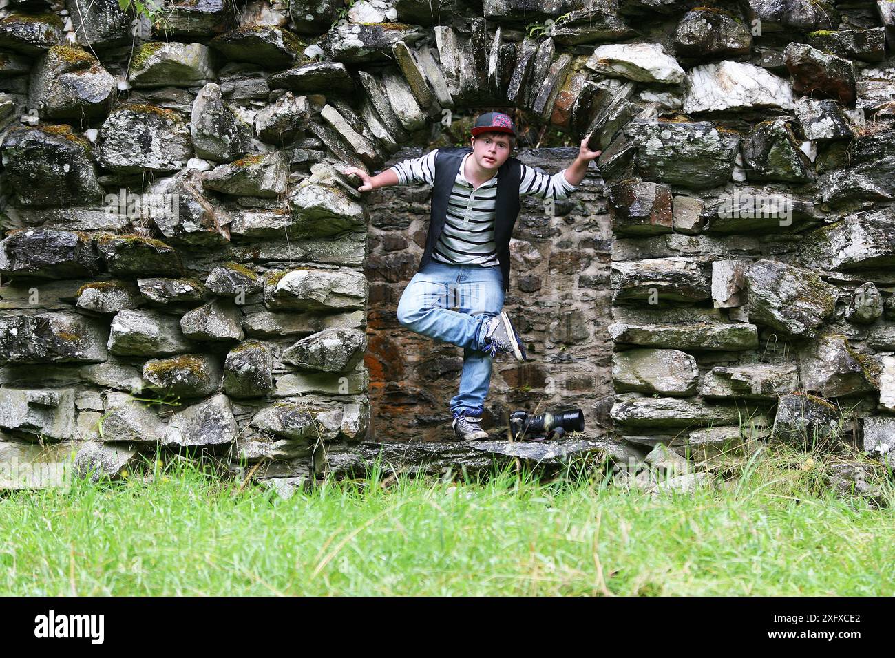 Photographer Oliver Hellowell in derelict building, UK. August 2014 ...