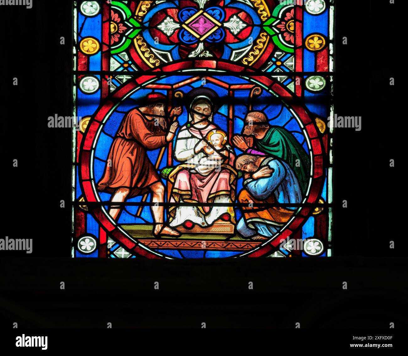 Three shepherds worship the new born Jesus Christ; window in the ...