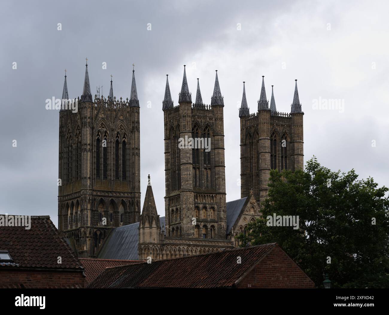 Triple towers of the christian medieval gothic cathedral in Lincoln ...