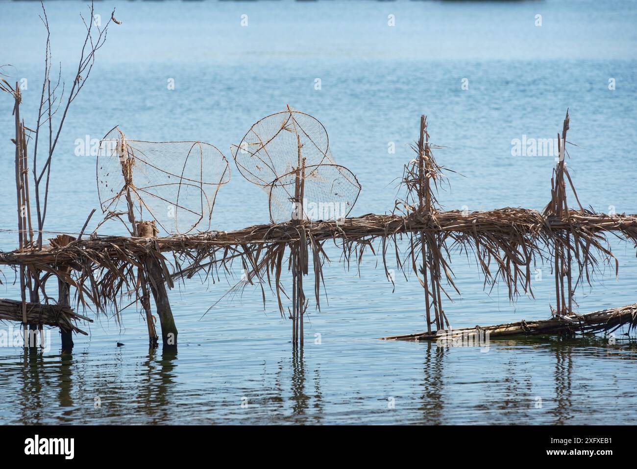 Reed fish traps and metal cages a typical method of fishing along the ...