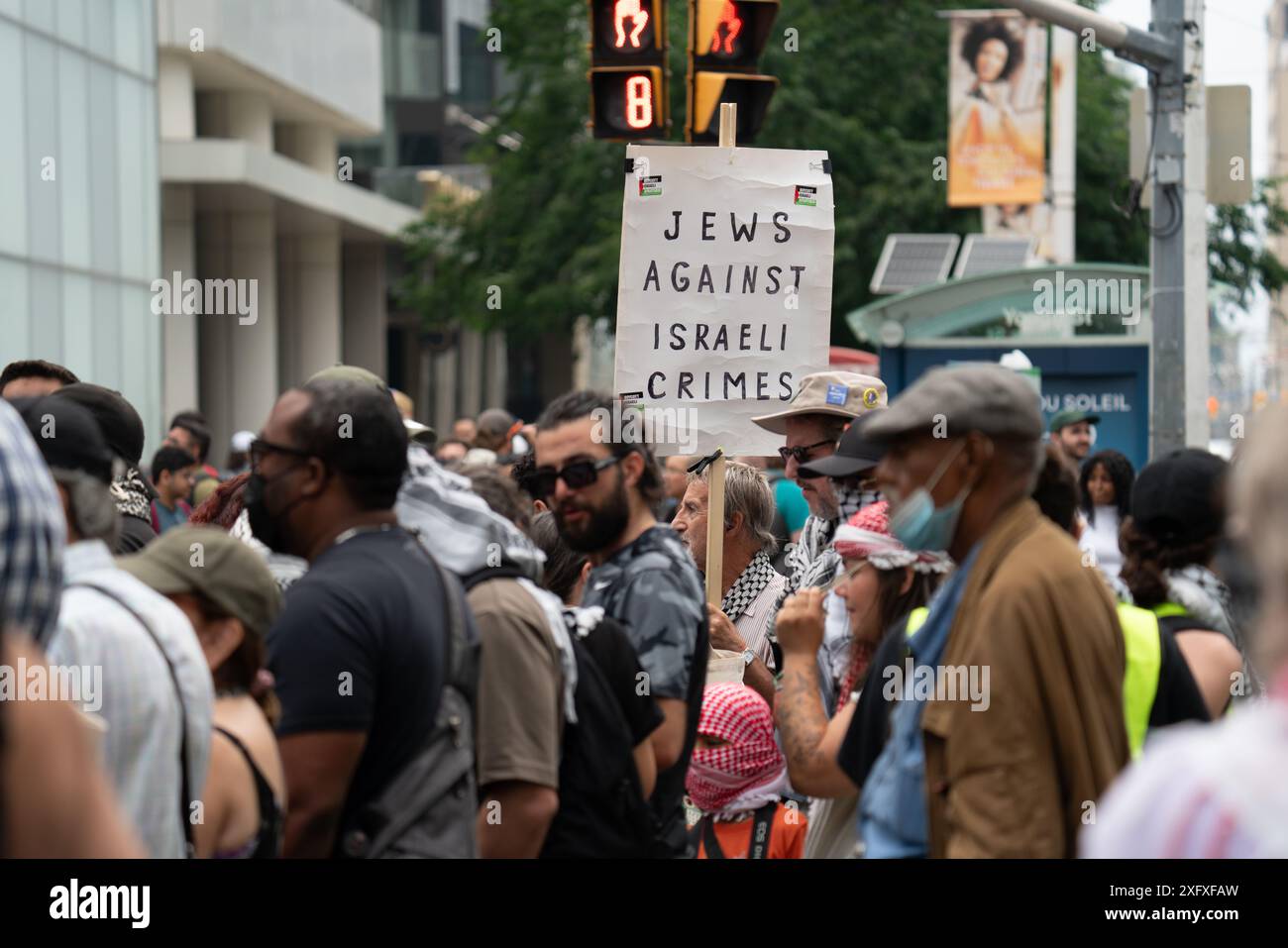 Protesters at the All Out For Gaza protest marching with picket signs ...
