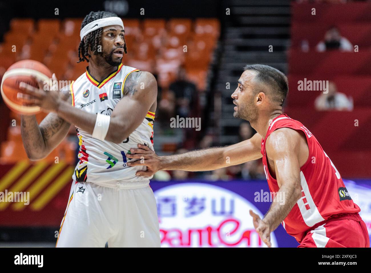 Selton Miguel (L) of Angola and Sergio El Darwich (R) of Lebanon seen ...
