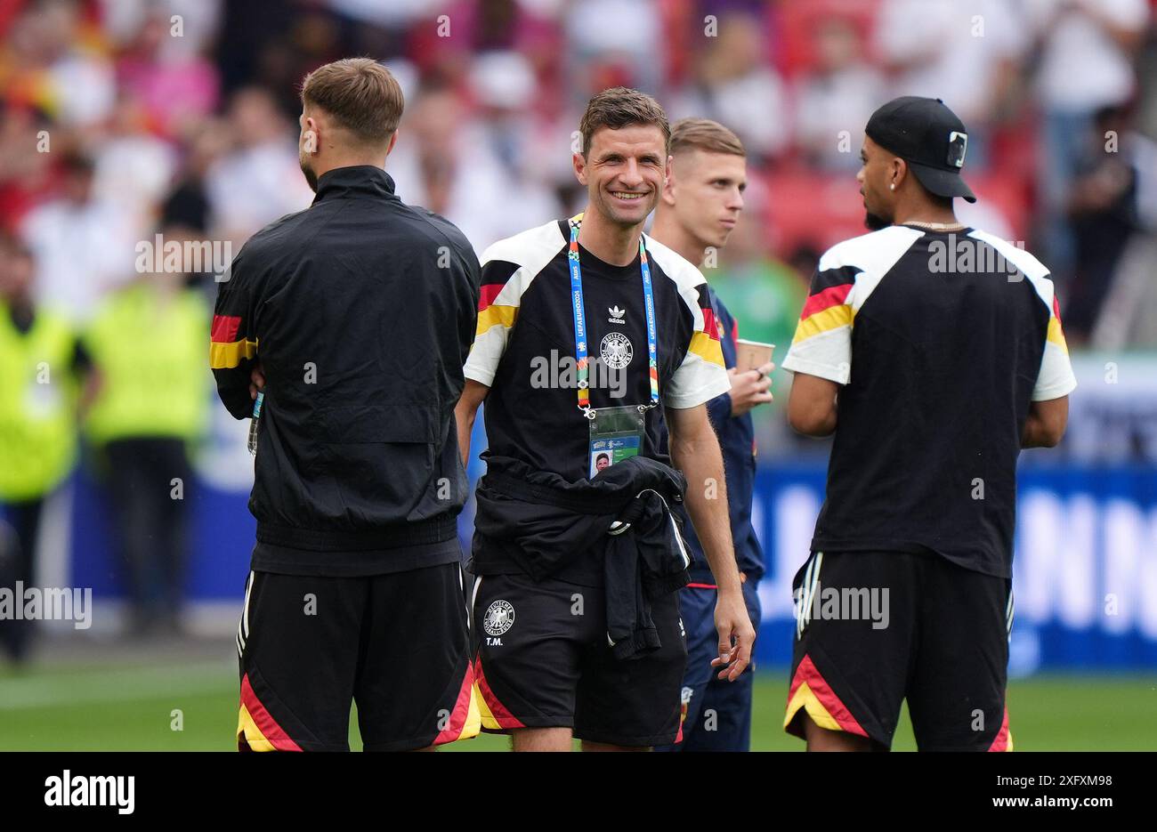 Germany’s Thomas Muller (right) arrives ahead of the UEFA Euro 2024 ...