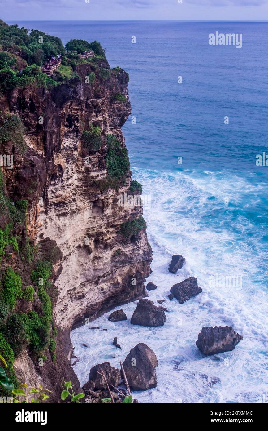 Ocean waves crash on rocks, creating a breathtaking spectacle on the ...