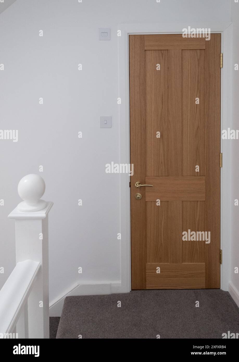 Wooden, shaker style, panelled internal doors with brass door furniture ...