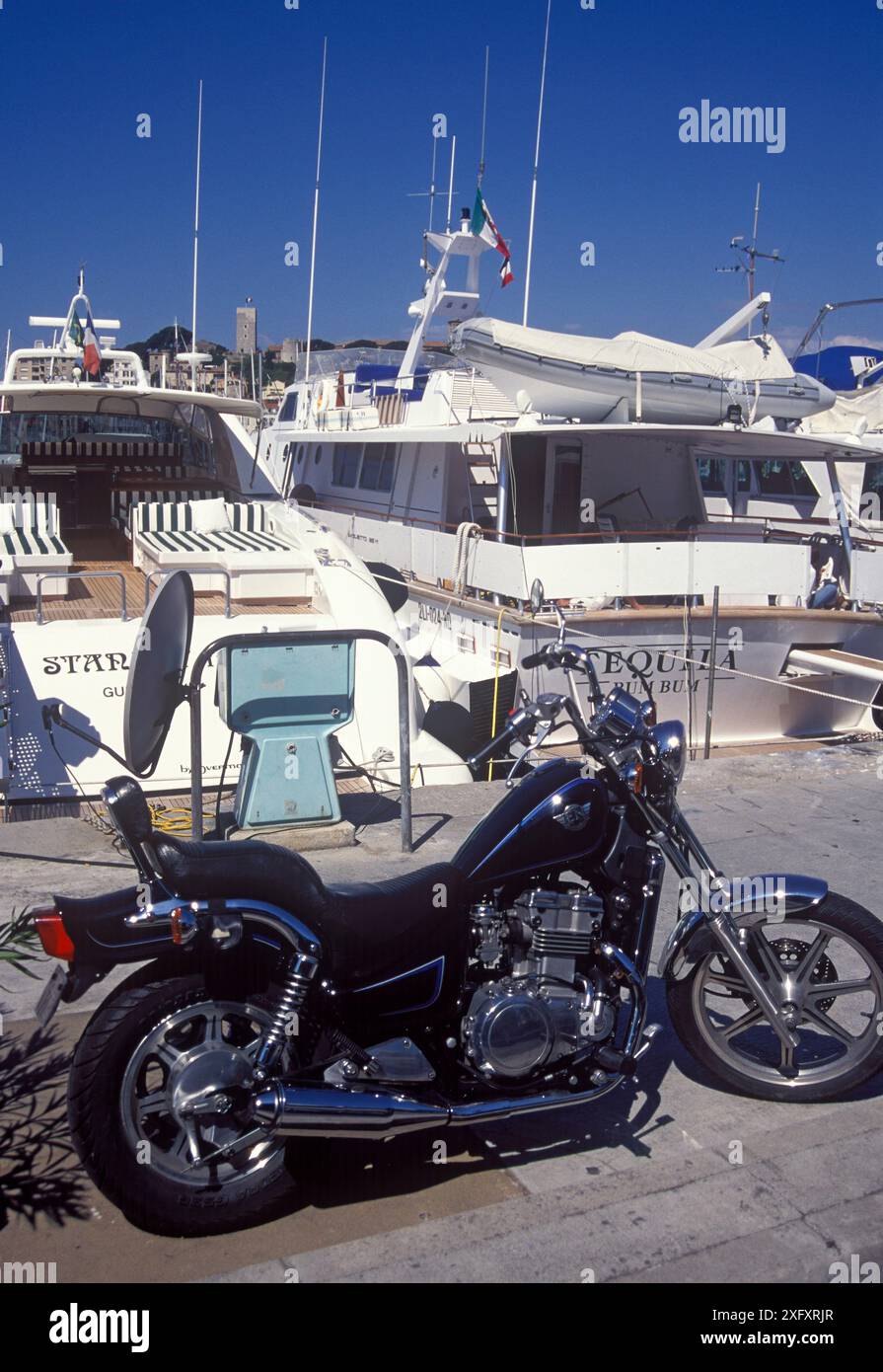 Motorcycle and boats Stock Photo - Alamy