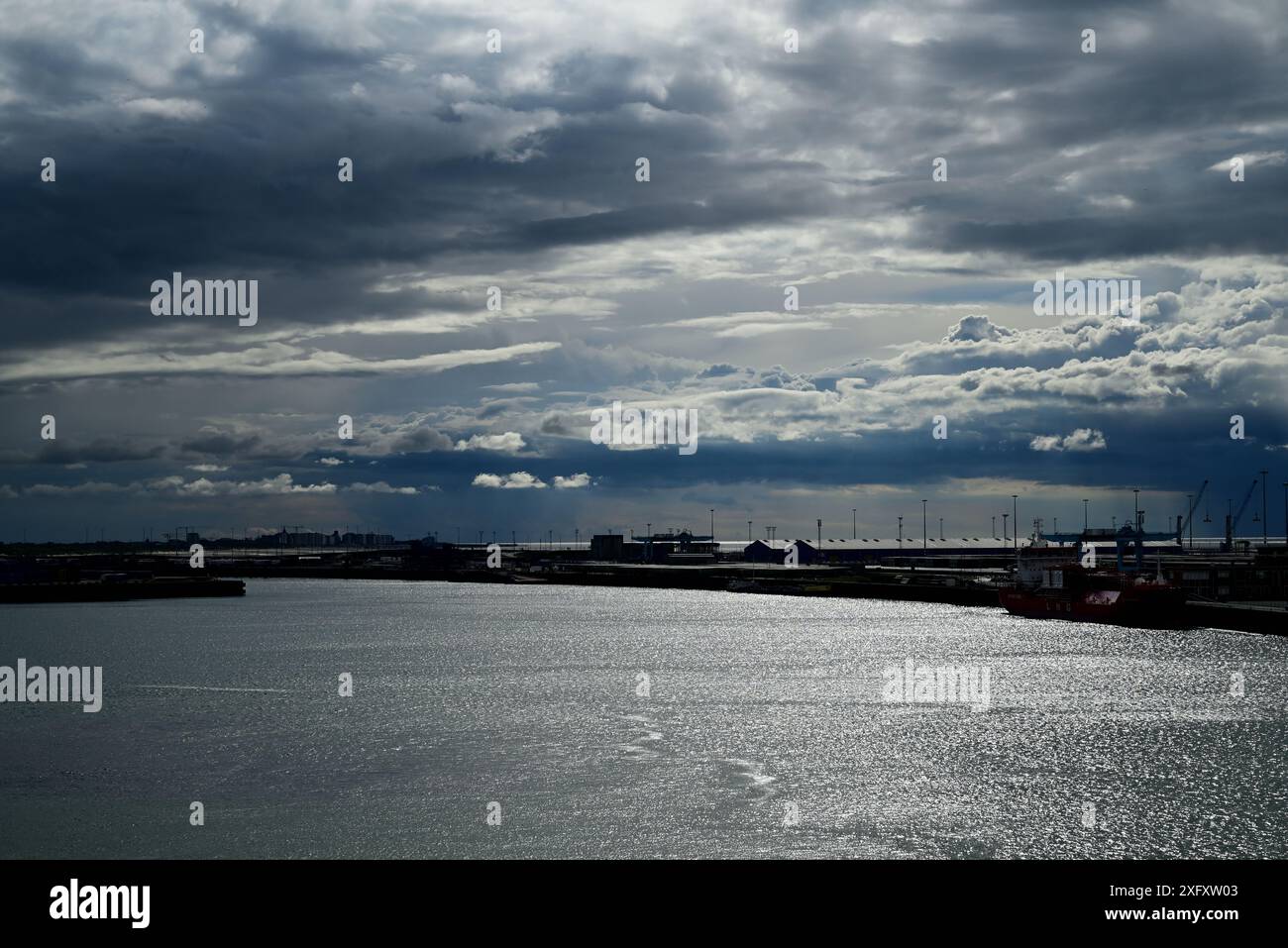Commercial harbor dark clouds hi-res stock photography and images - Alamy