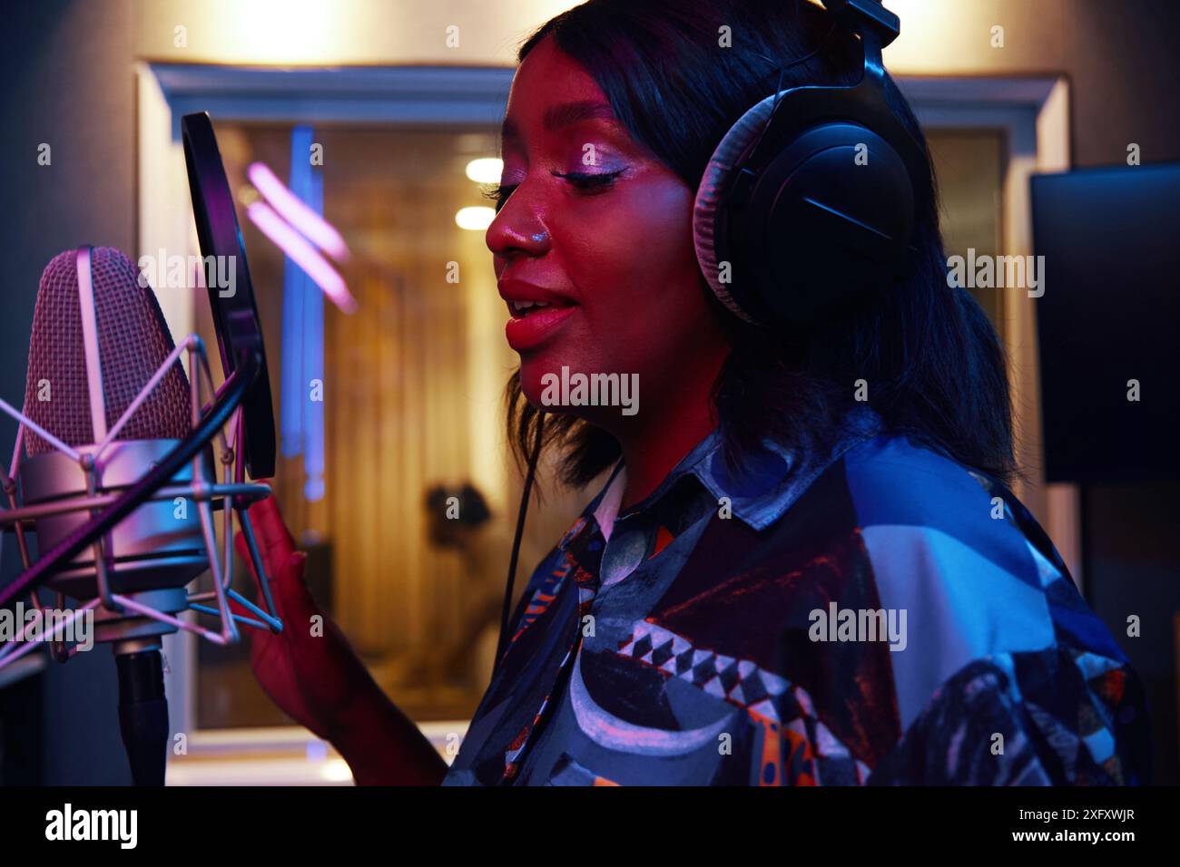 Singer Rehearsing In Recording Studio Stock Photo - Alamy
