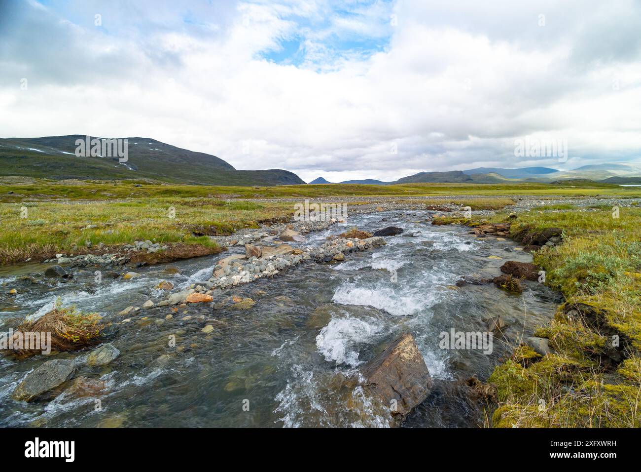 A small, rocky mountain stream in Sarek National Park, Sweden. A ...