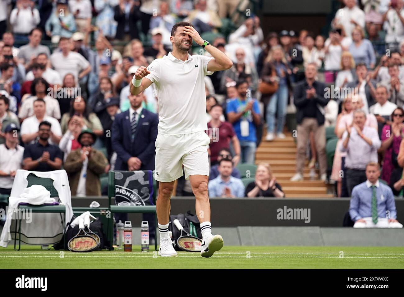 Grigor Dimitrov celebrates victory over Gael Monfils on day five of the ...