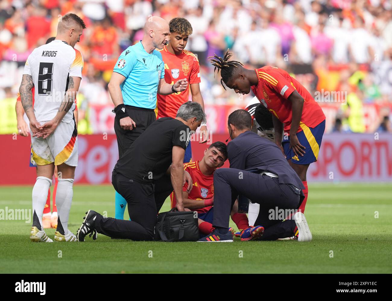 Spain's Pedri is treated for an injury before leaving the game during ...