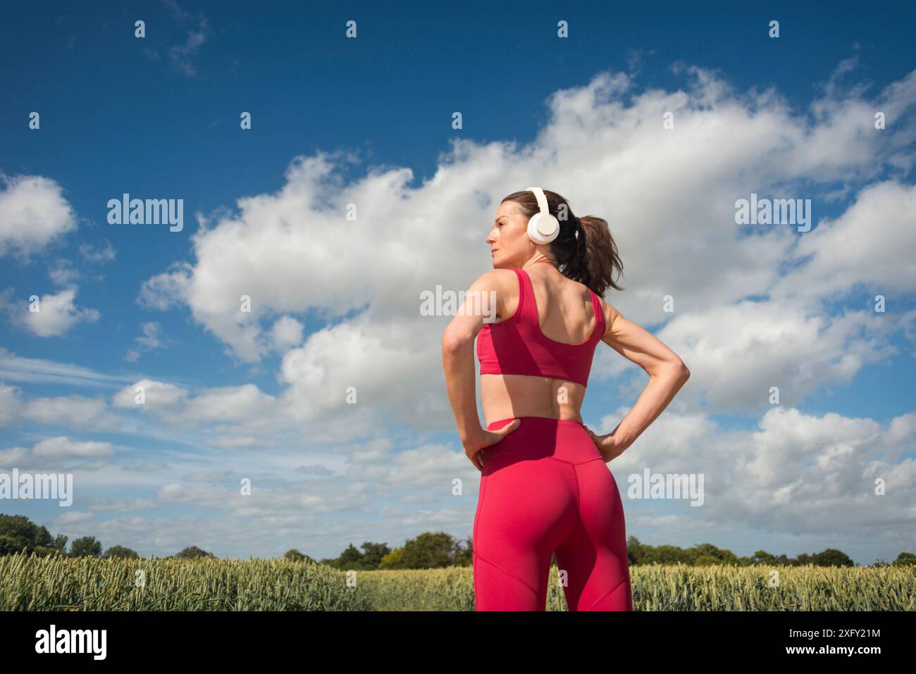 Back view woman headphones hi-res stock photography and images - Alamy