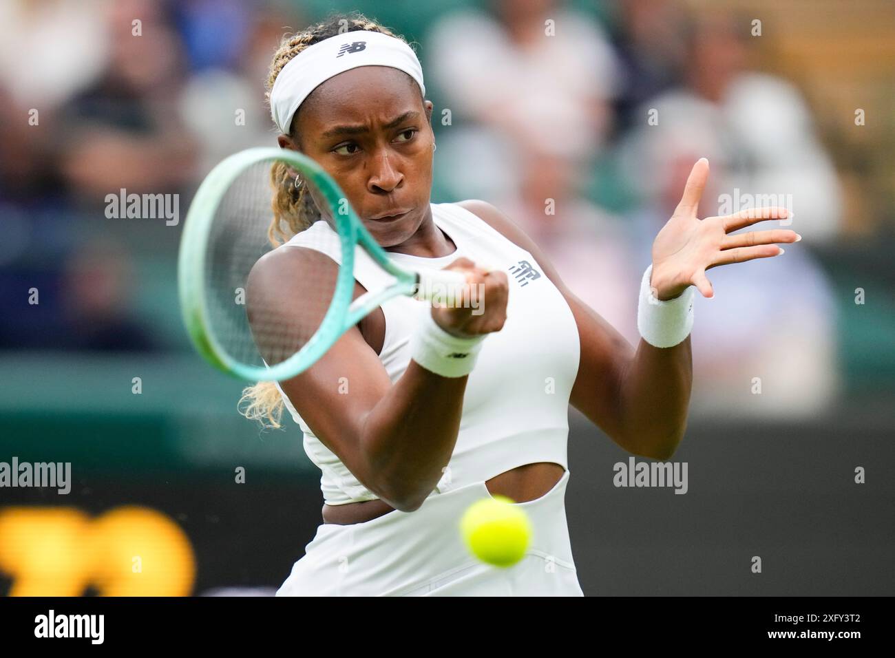 Coco Gauff of the United States plays a forehand return to Sonay Kartal ...