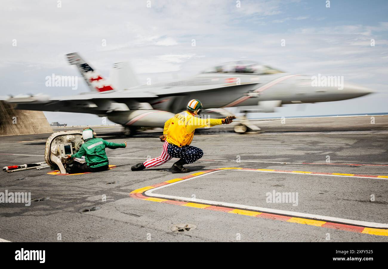 Lt. David Bailey, from Millersville, Maryland, assigned to air department’s V-5 division, shoots ...