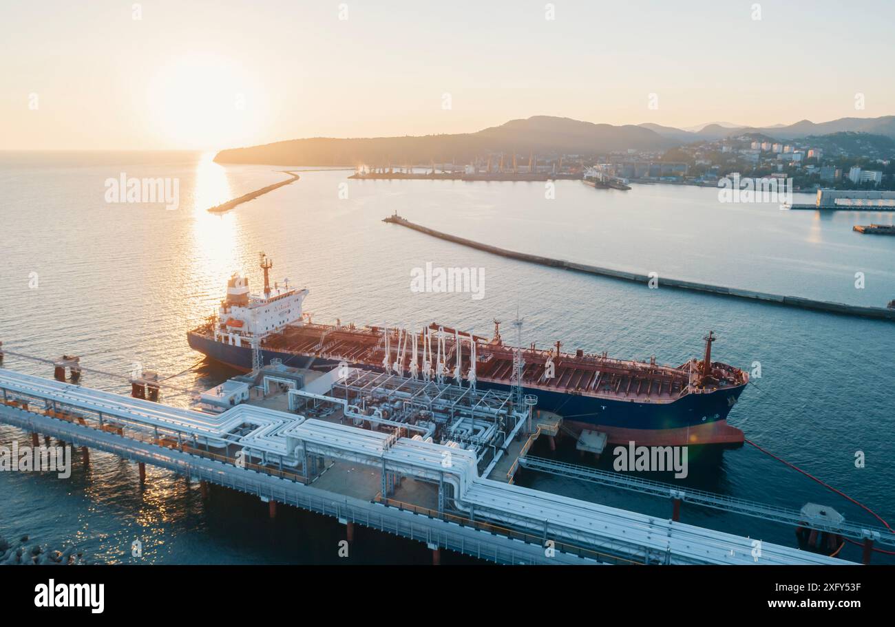 Aerial view of a large oil tanker docked at a pier in the port in ...