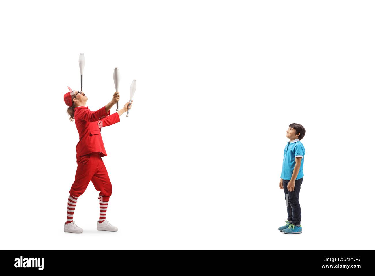 Boy watching a man juggling isolated on white background Stock Photo ...