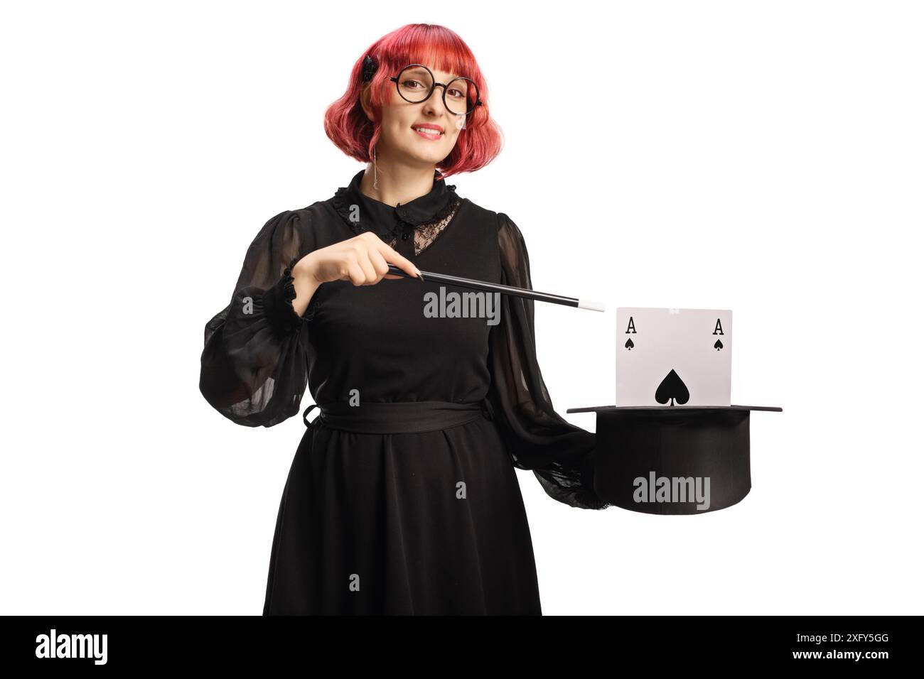 Female magician with a top hat and cards holding a wand isolated on ...