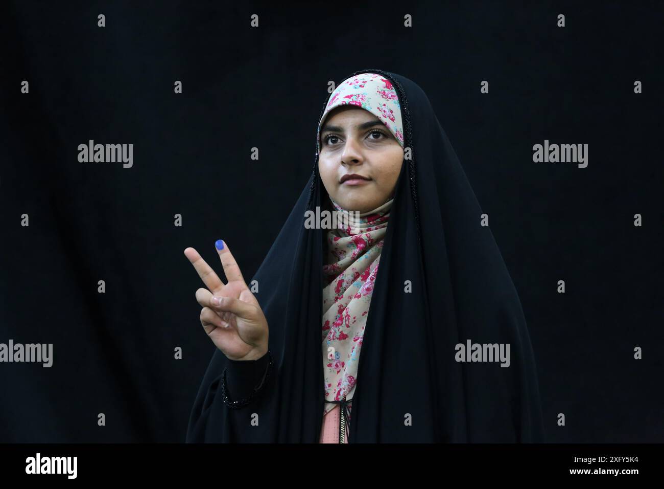 Qarchak, Tehran, Iran. 5th July, 2024. An Iranian veiled woman flashes ...