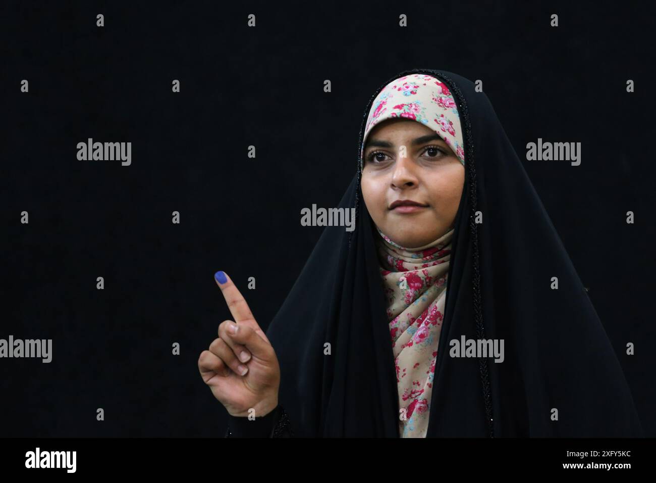 Qarchak, Tehran, Iran. 5th July, 2024. An Iranian veiled woman shows ...