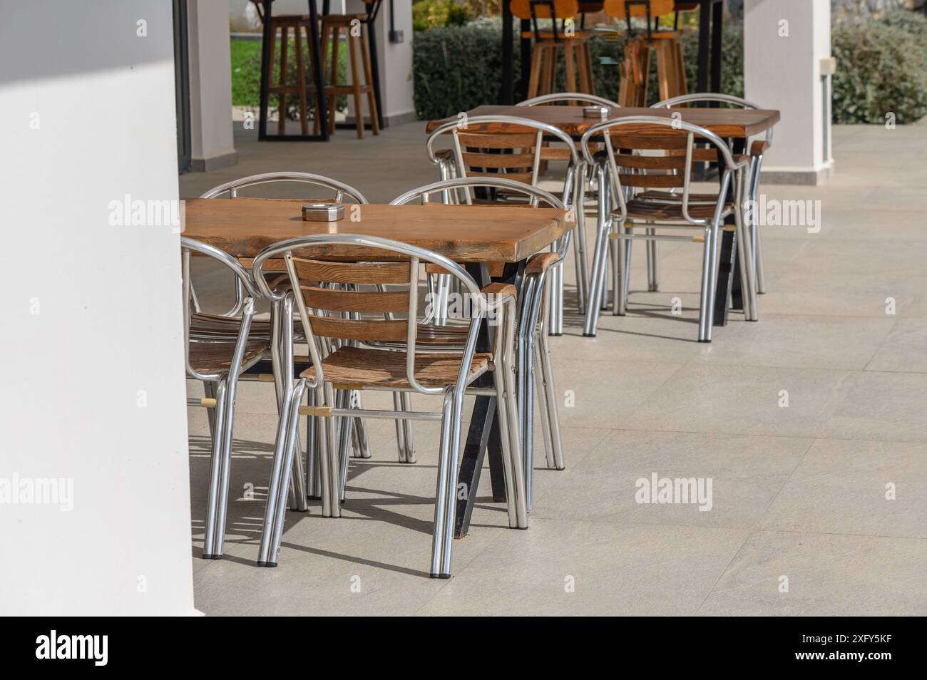 tables and chairs in a cafe in Cyprus Stock Photo - Alamy