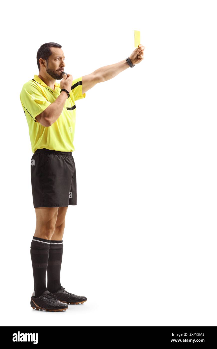Football referee holding up a yellow card isolated on white background ...