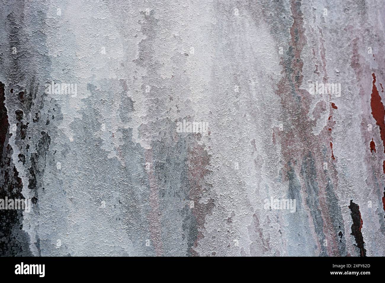 Old building materials, rusty metal sheets with white and red paint ...