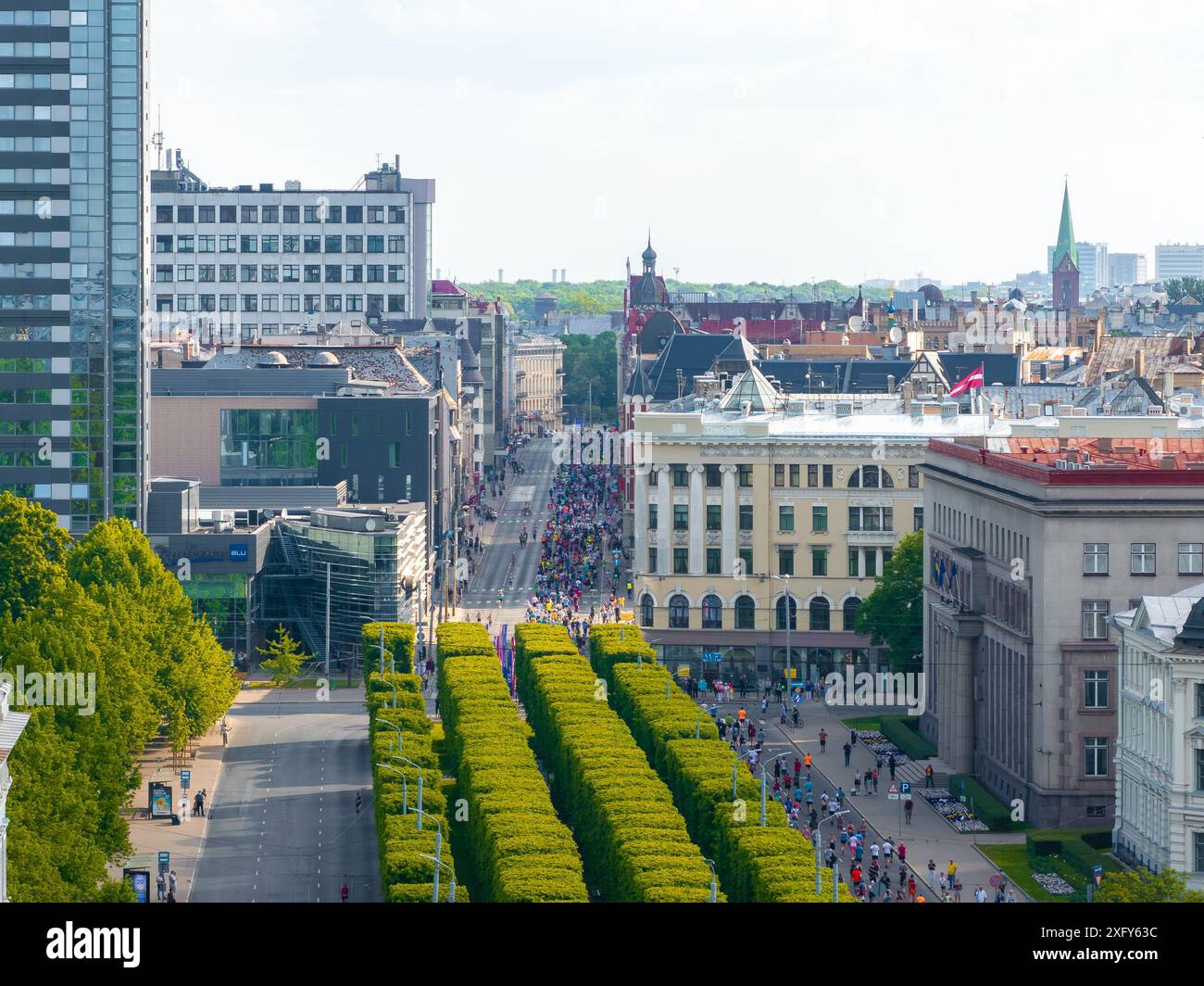 Aerial View of Marathon Runners in Riga City Streets with Skyscrapers ...