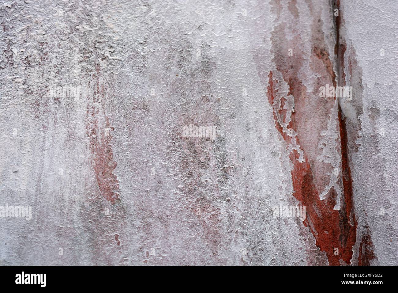 Old building materials, rusty metal sheets with white and red paint ...