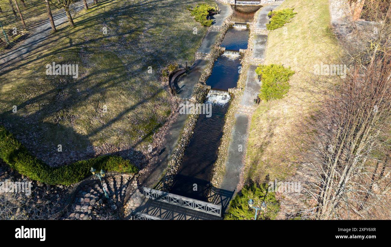 Drone photography of small dams, waterfalls and pedestrian bridge ...