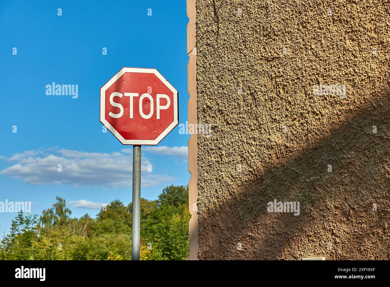 Stop sign on a corner Stock Photo - Alamy