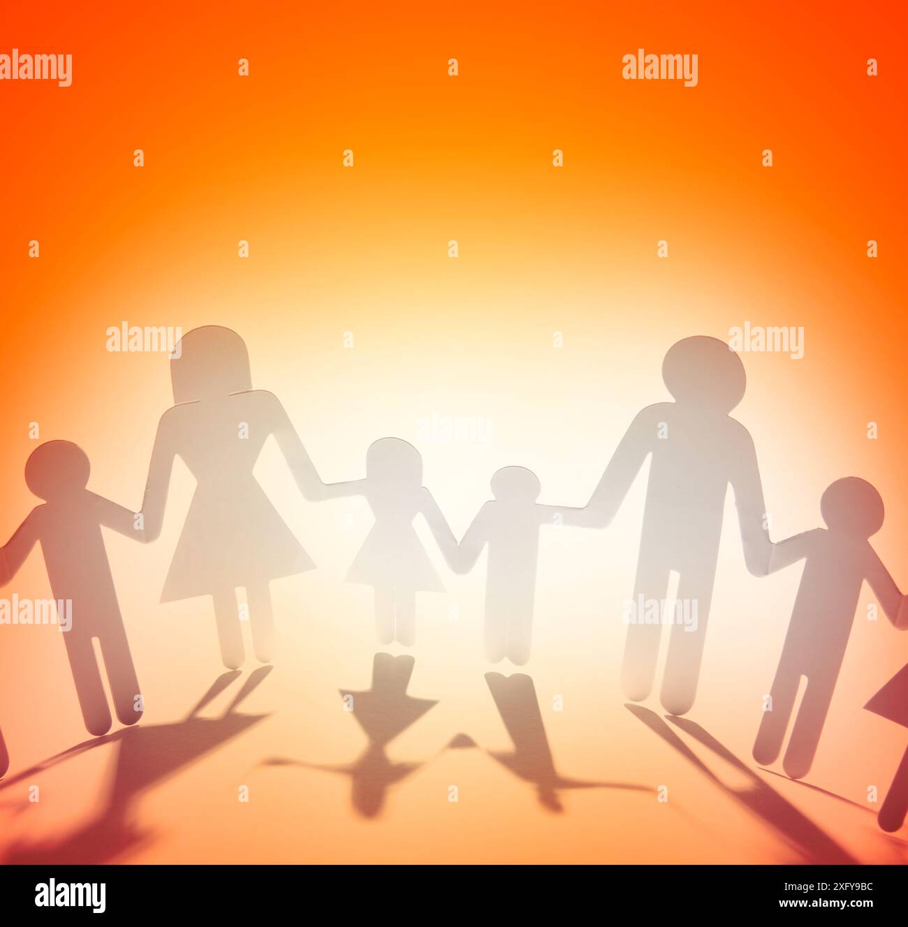 Family paper chain cutout holding hands Stock Photo - Alamy