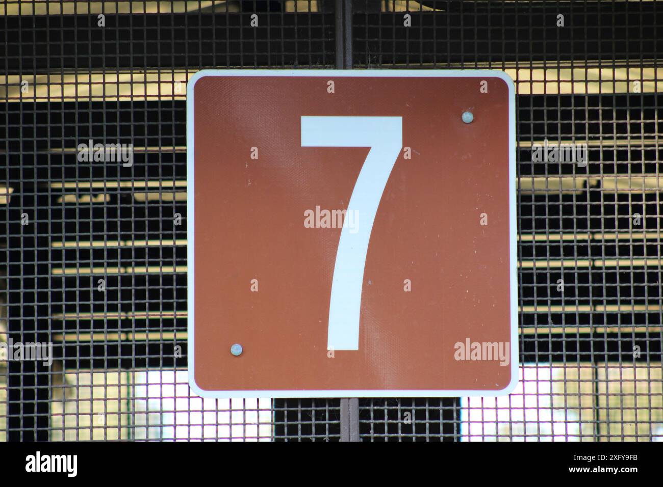 7 number seven sign on fence Stock Photo - Alamy