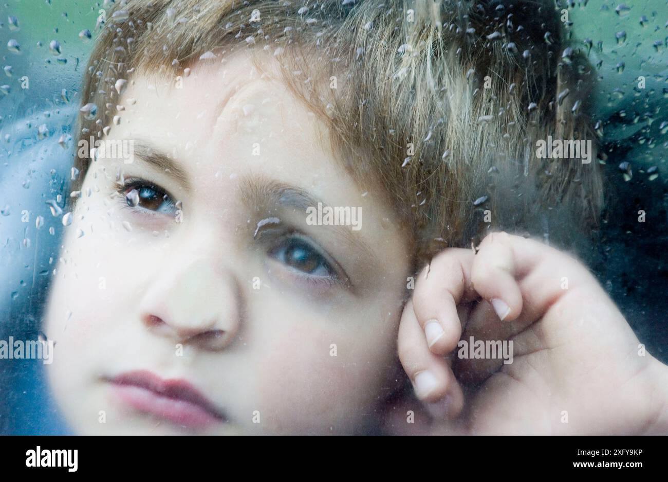 Child wet rain sad hi-res stock photography and images - Alamy