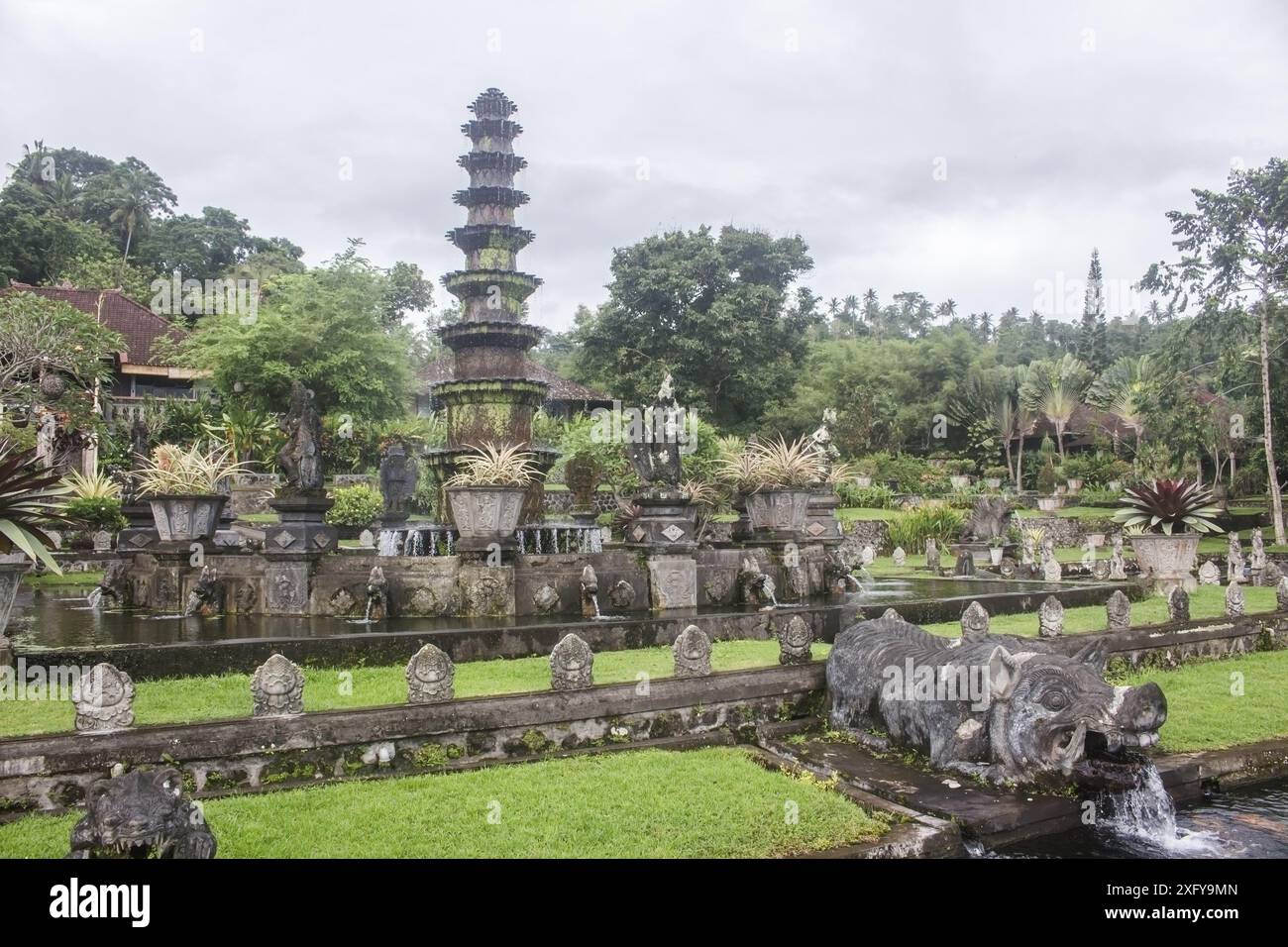 Water fountains and stone statues at Tirtagangga water palace in Bali ...