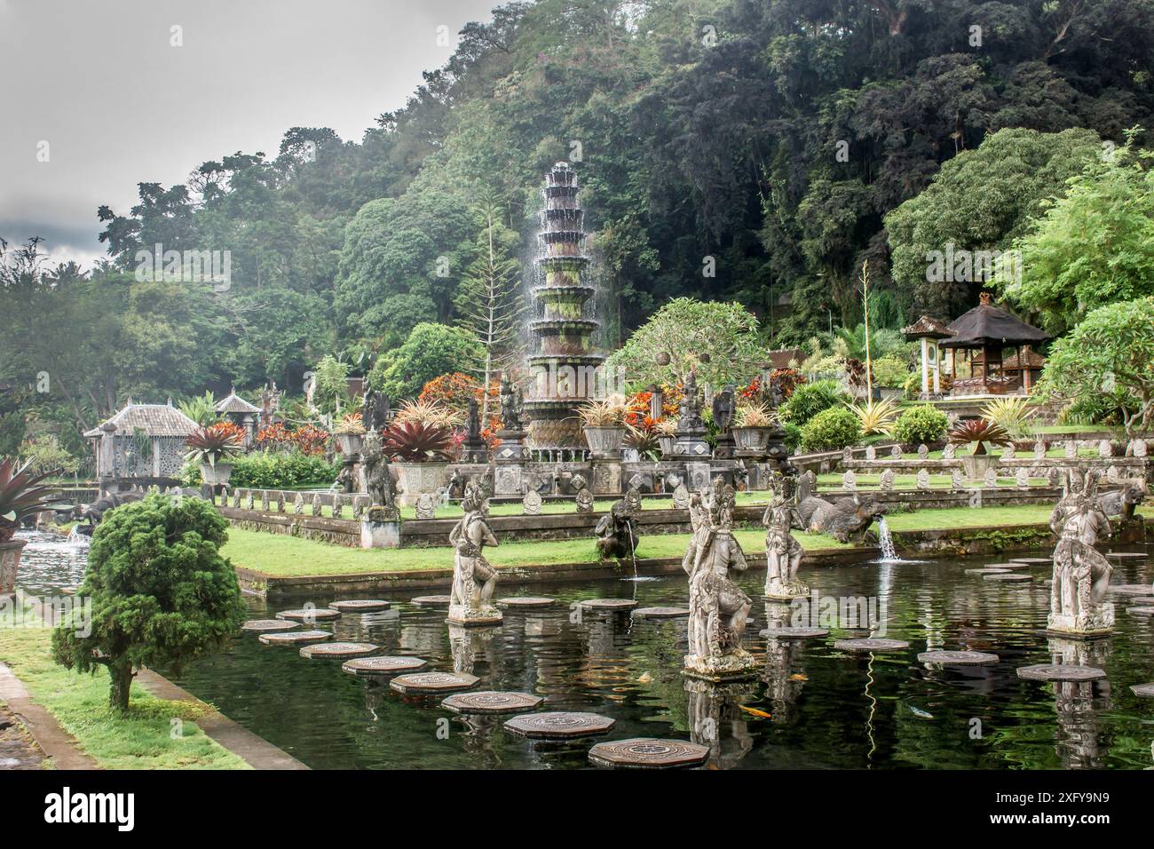 Tirtagangga water palace in Bali. Water fountains, sush green ...