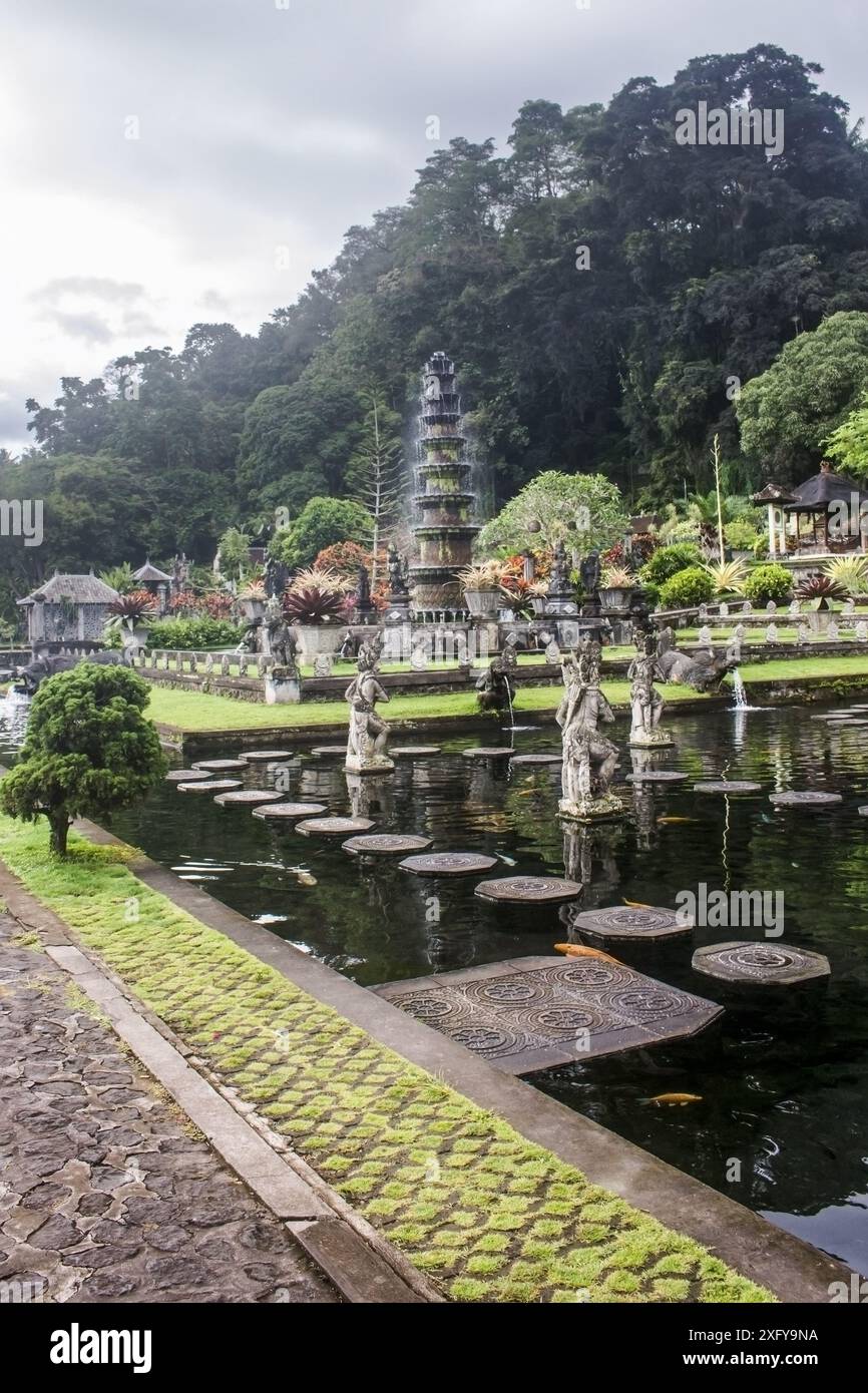Tirtagangga water palace in Bali. Water fountains, sush green ...