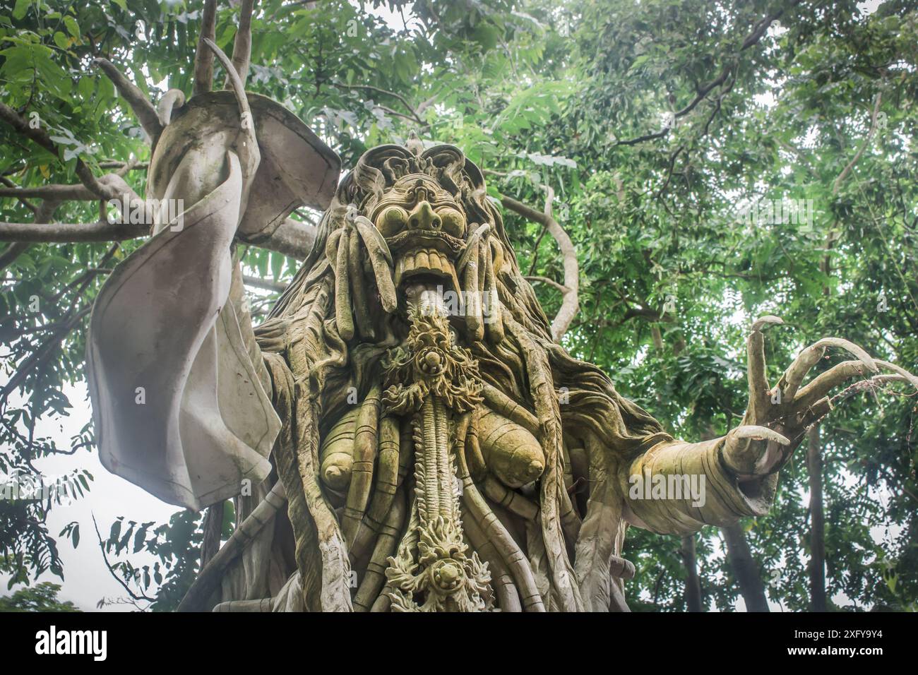 Religious statue in Tirta gangga water palace in Bali. Fertility statue ...